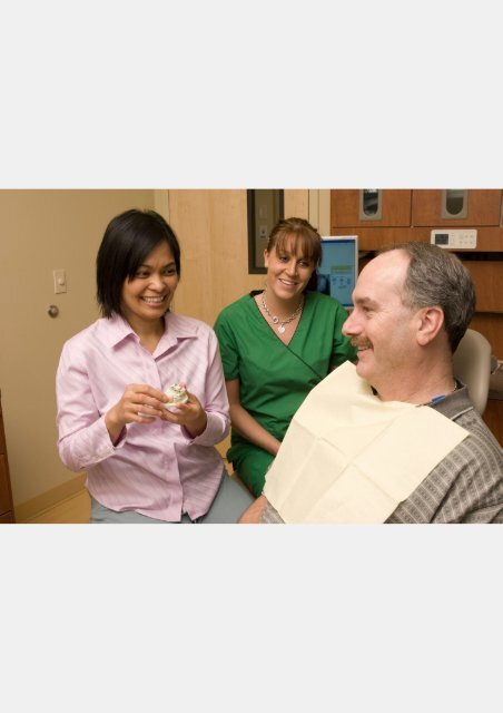 Dr. Ranola explains dental implants procedure to her patient